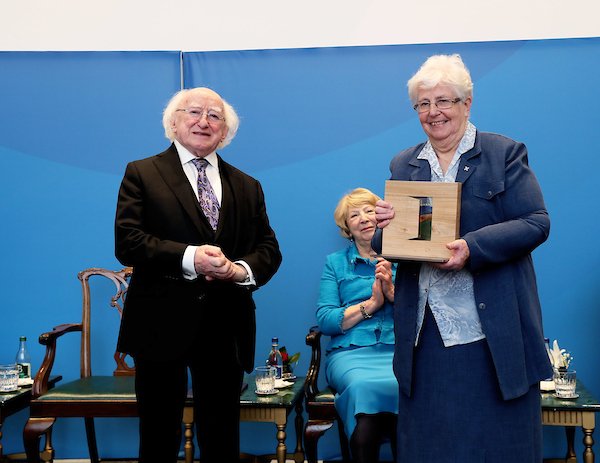 Sr. Pat Murray ibvm receives the Presidential Distinguished Service Award from President Higgins ...